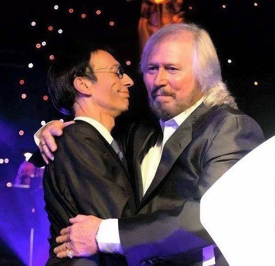 On the stage of American Idol, Barry and Robin Gibb stood side by side ...